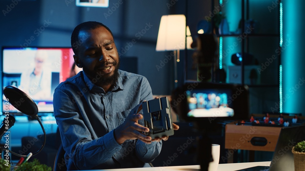 Tech content creator filming technology review of newly launched V ...