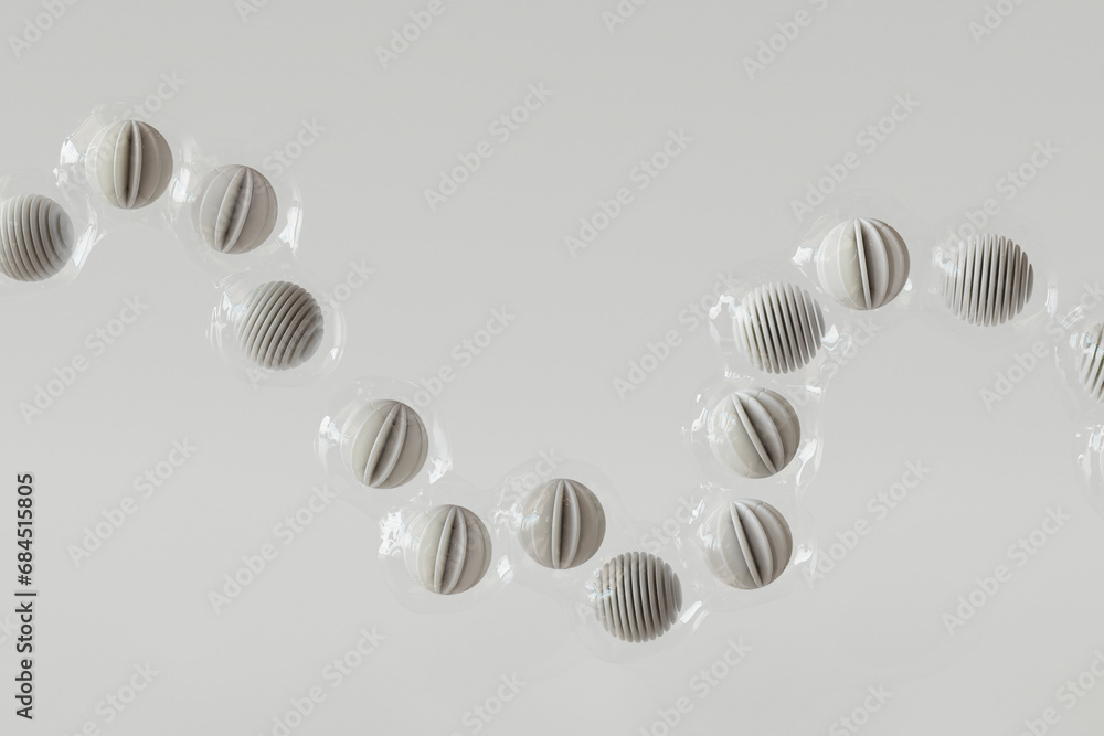 3D render of row of plastic wrapped spheres floating against white ...