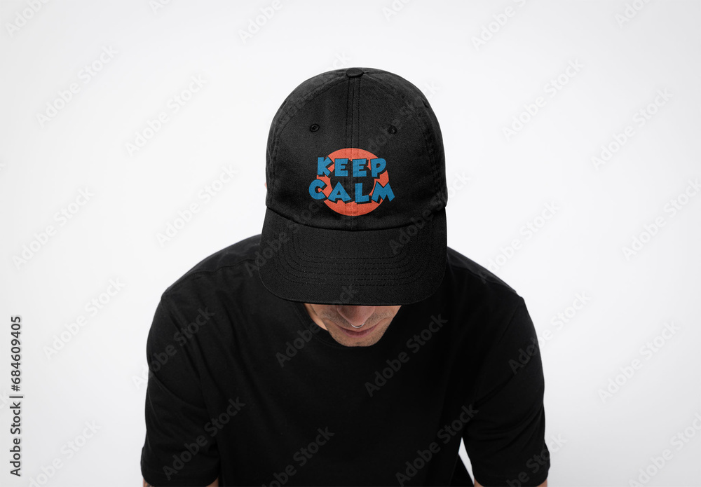 Mockup of man wearing customizable cap in studio looking down Stock ...