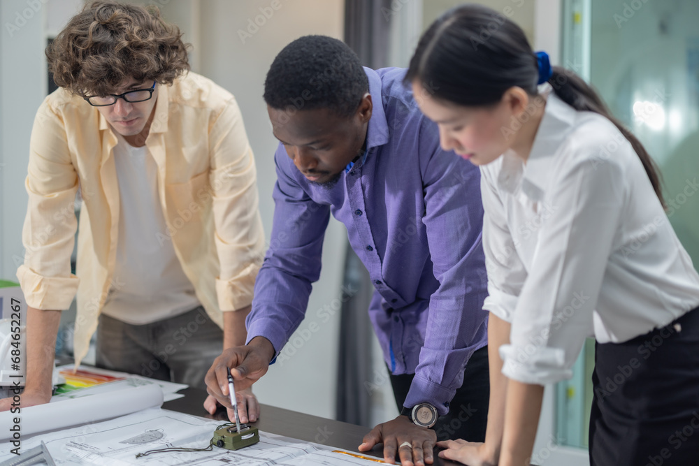 Architects plan low-carbon construction, analyzing blueprint, layout ...