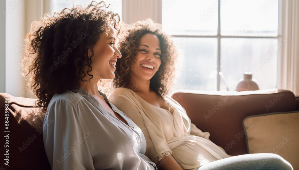 Two happy multi ethnic pretty diverse young girls friends laughing and ...