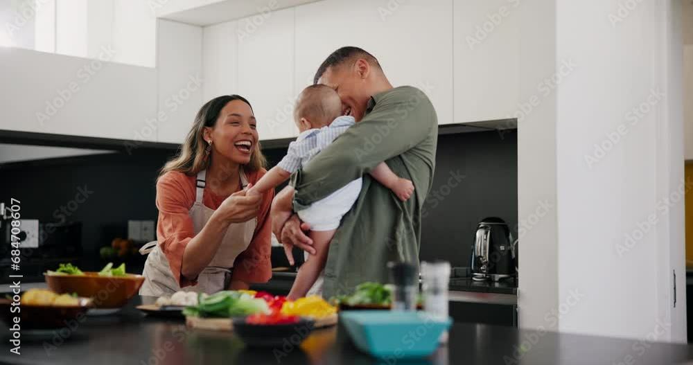 Baby, funny and a couple cooking in the kitchen of their home together ...