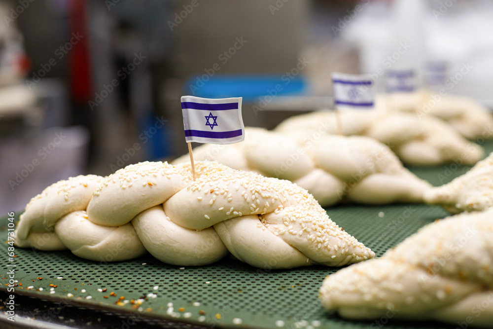 Making braided bread in a bakery. Traditional Shabbat challah Stock ...