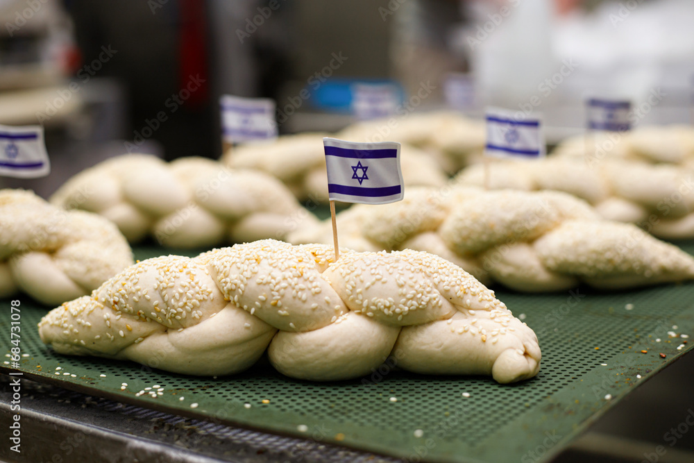 Making braided bread in a bakery. Traditional Shabbat challah Stock ...