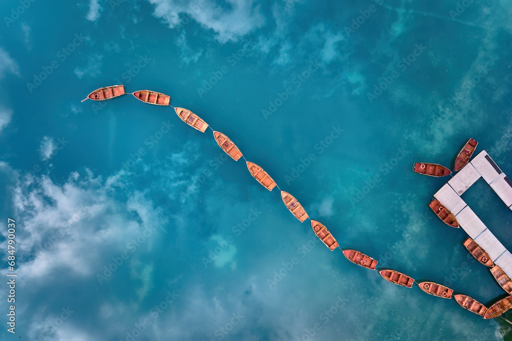 An artistic, perpendicular view of an axis shape made of wooden boats ...