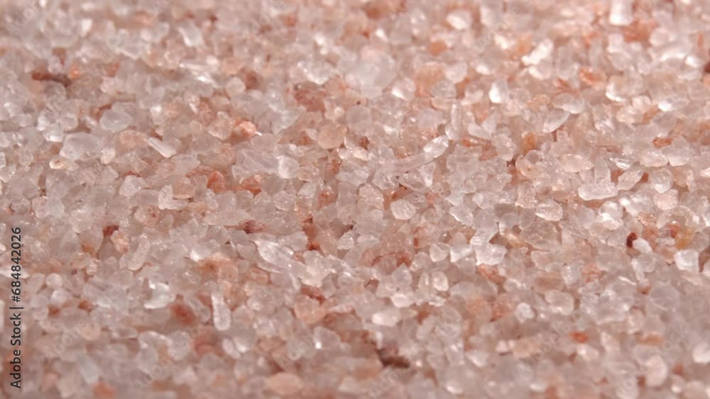Pink himalayan salt or rock salt rotating close up background side ...