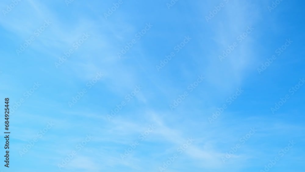 4K : Blue sky time lapse - The sky transforms from a soft morning hue ...