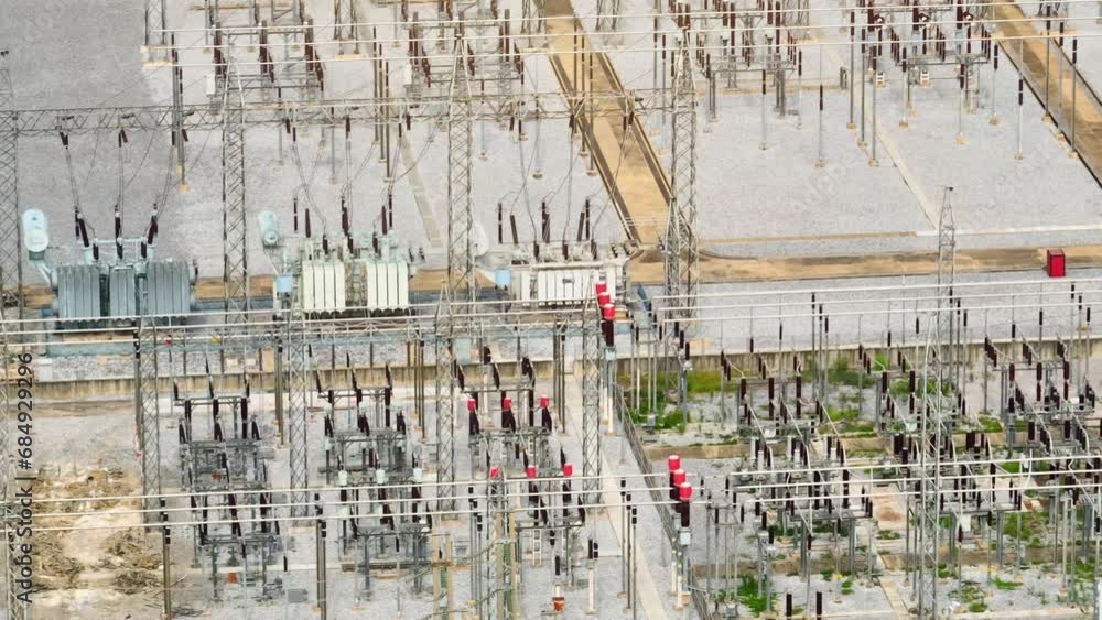 A high voltage power station, a vital hub in the grid, generates and ...