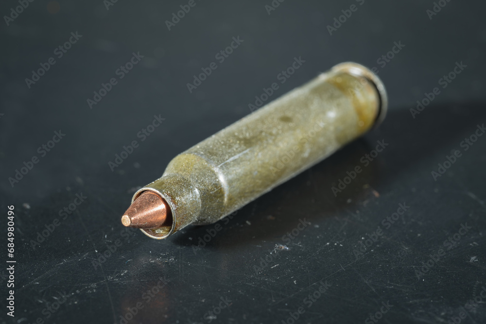 Fotografia do Stock: A cartridge with an iron case of 5.56x45mm caliber ...