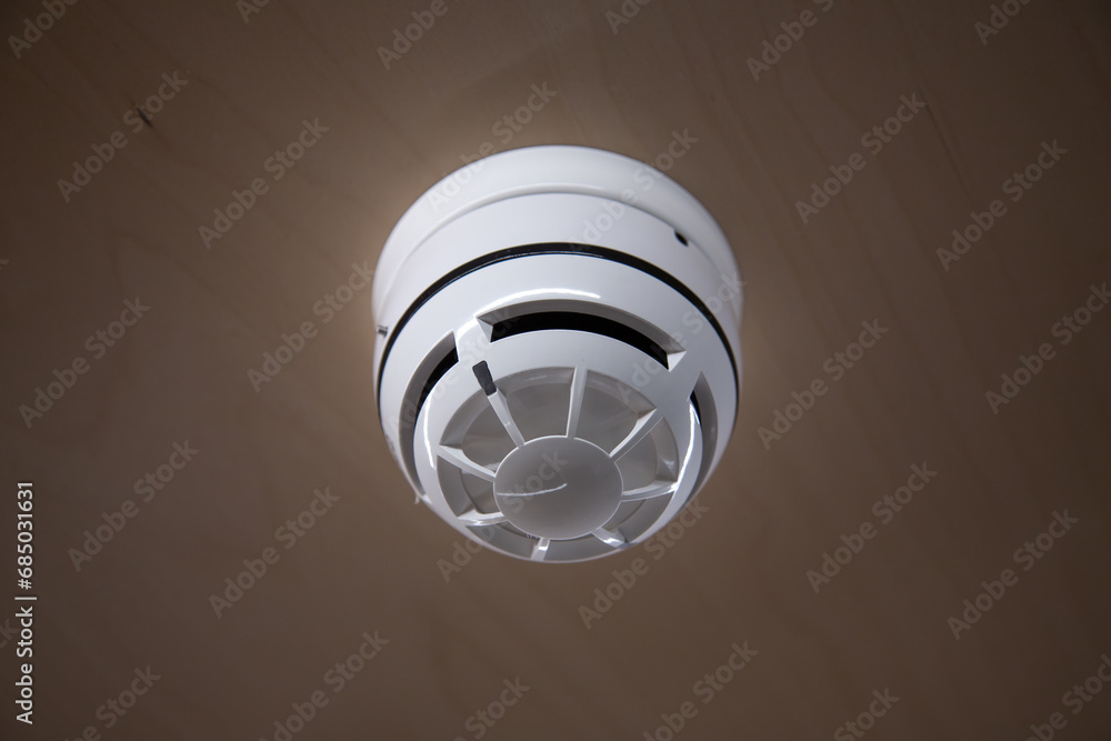 Smoke detector at the wood panel ceiling. smoke alarm detector. Stay ...