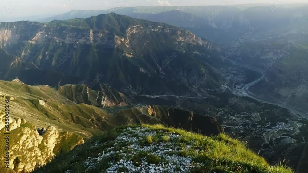 A green mountain range with a valley in the background. The untamed ...