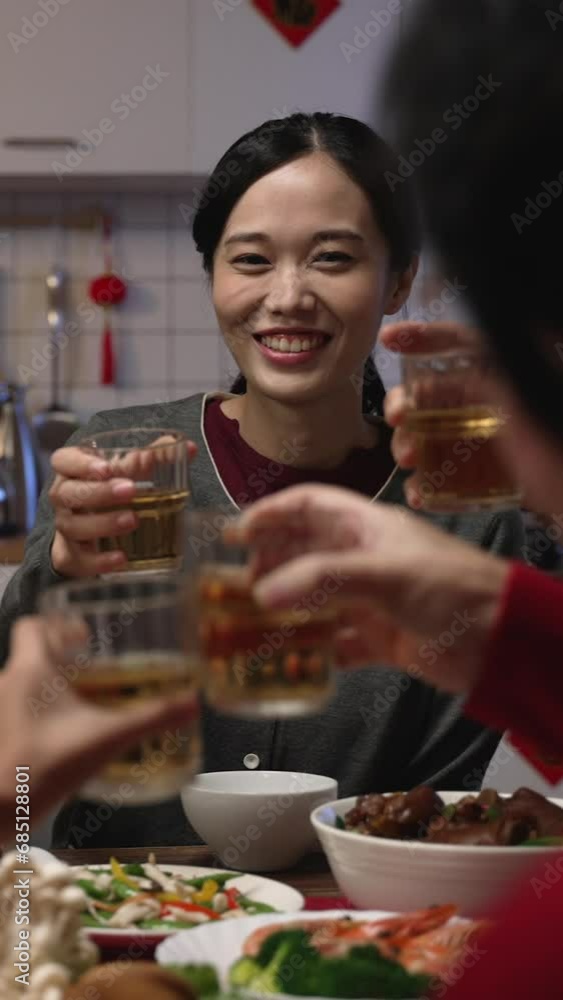 Vertical Screen: happy young asian woman drinking toast with tea to ...