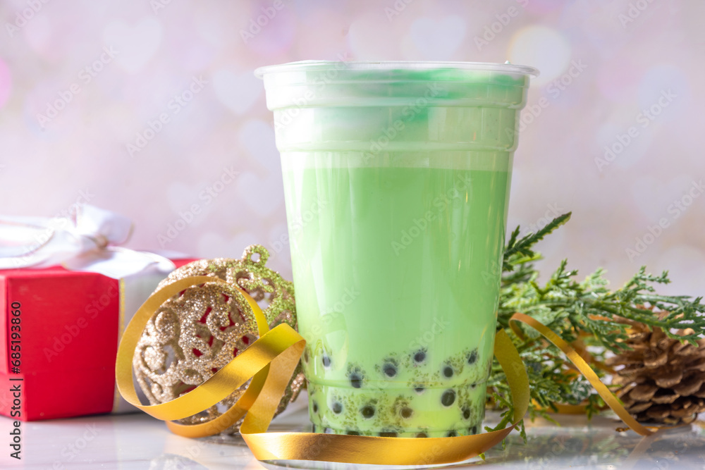 Green Christmas bubble tea drink, cold tasty sweet latte drink with ...