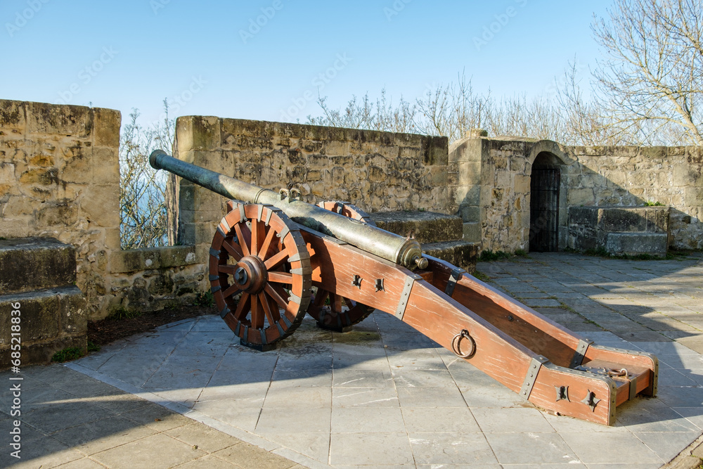 Antique cannon artillery defensive weapon at historic fort building ...