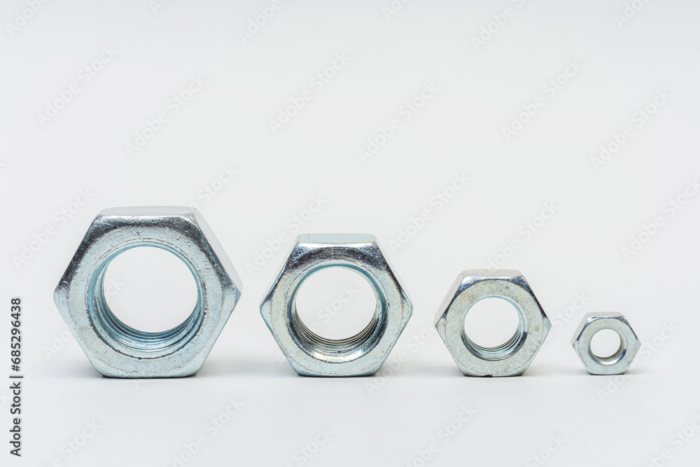 iron nut on a white background. metal nut on a light background. photos ...