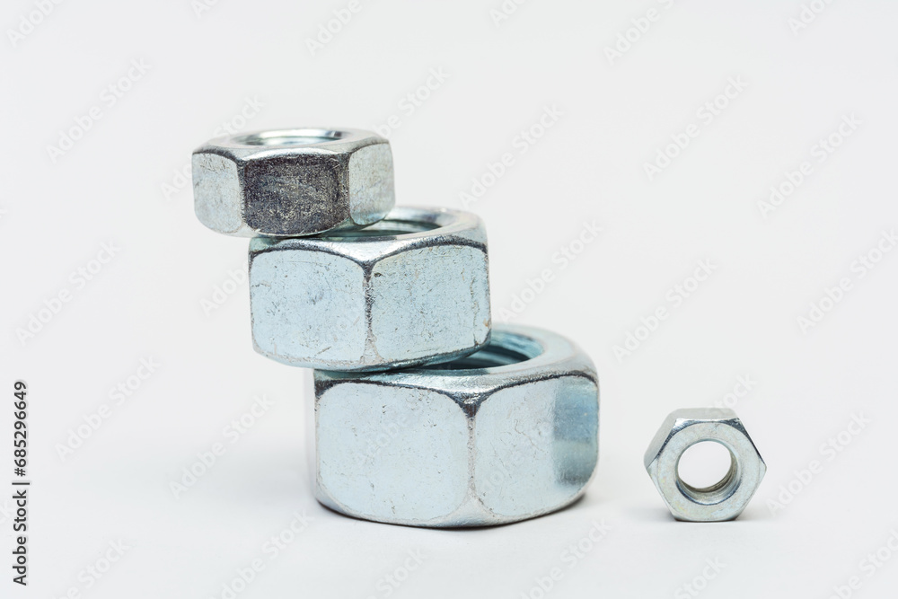iron nut on a white background. metal nut on a light background. photos ...