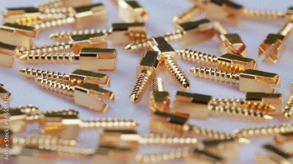 Titanium dental pins rotate on a white background for insertion into ...