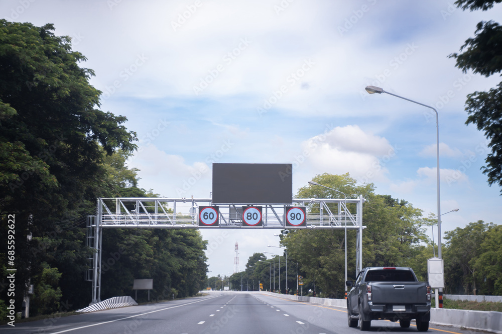 Road signs warn of "average speed detection zones" and speed limits for ...