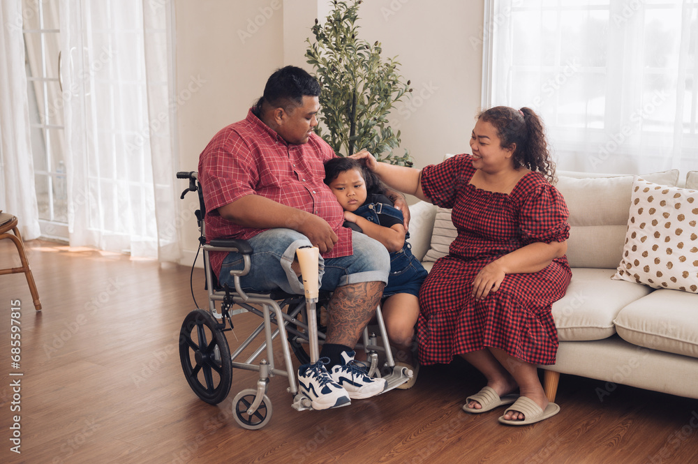 The family of a large, fat man whose father wears a prosthetic leg sits ...