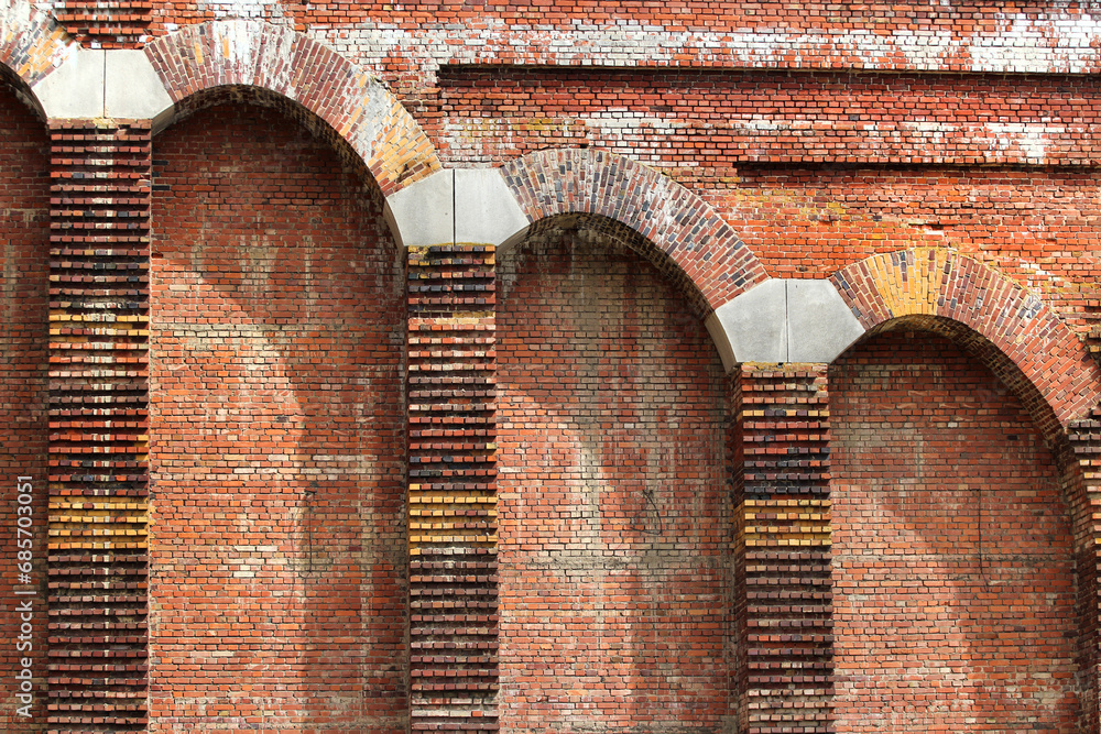 Old red brick wall with protruding columns as background Stock Photo ...