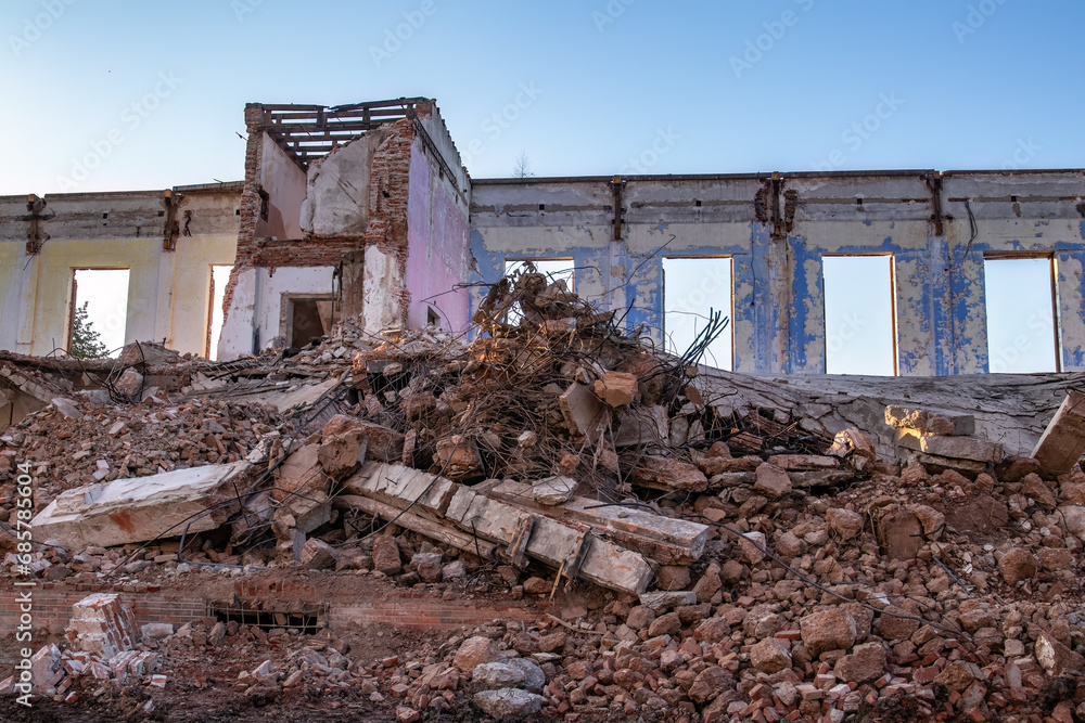 Demolition of an industrial building. In the foreground is the rubble ...