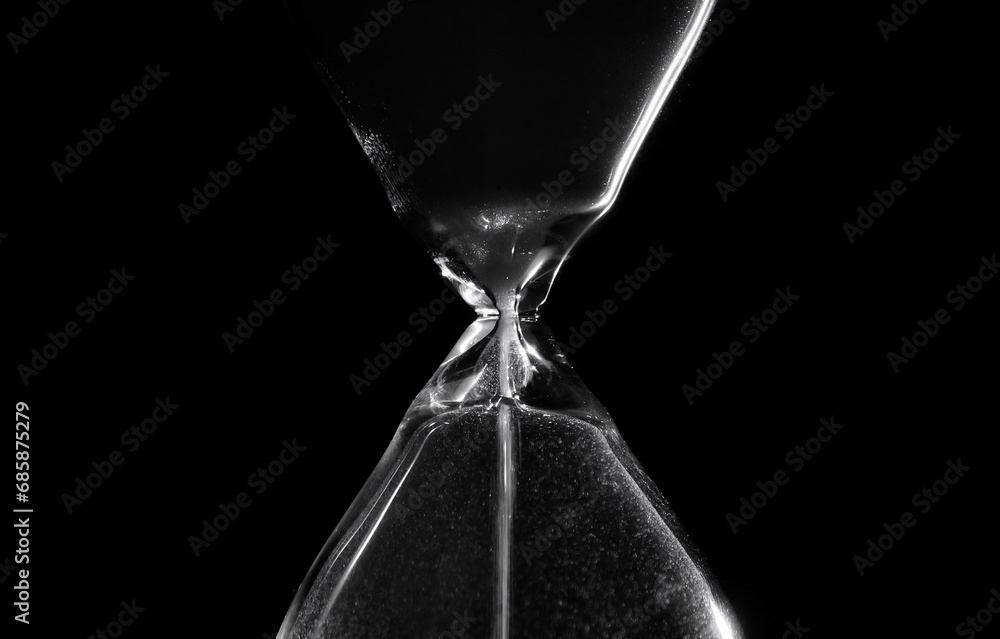 Hourglass. Sands move through hour glass. Close up. Pass of time and ...