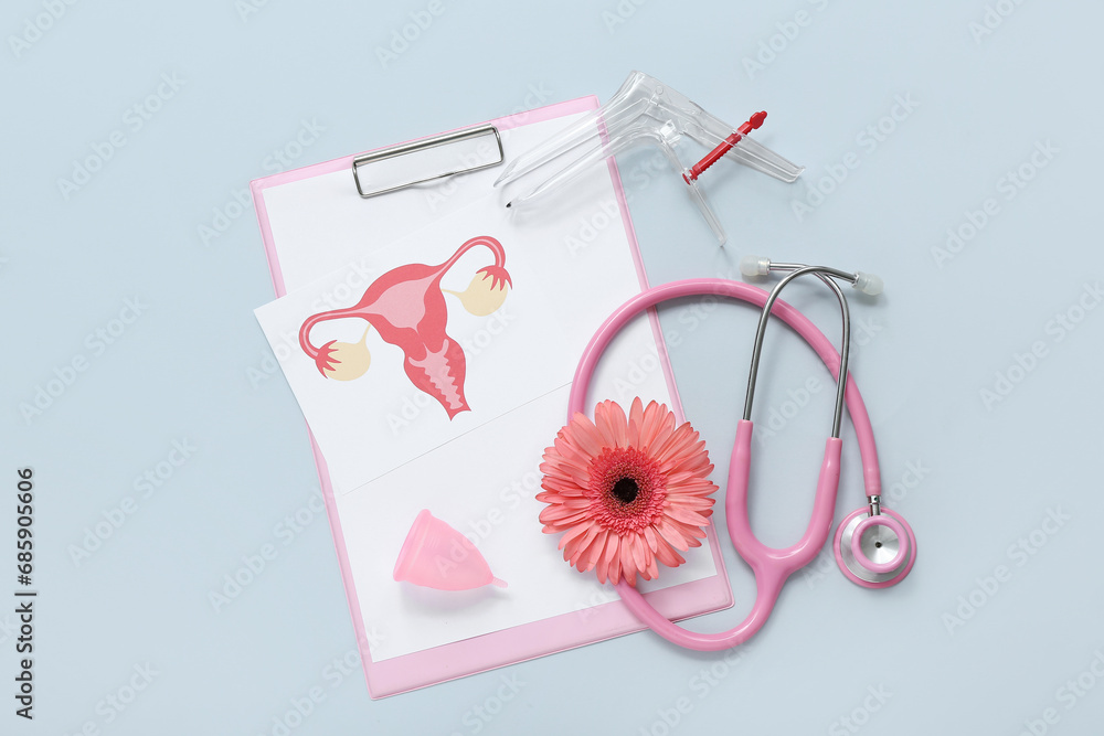 Gynecological speculum, stethoscope, gerbera flower, menstrual cup ...