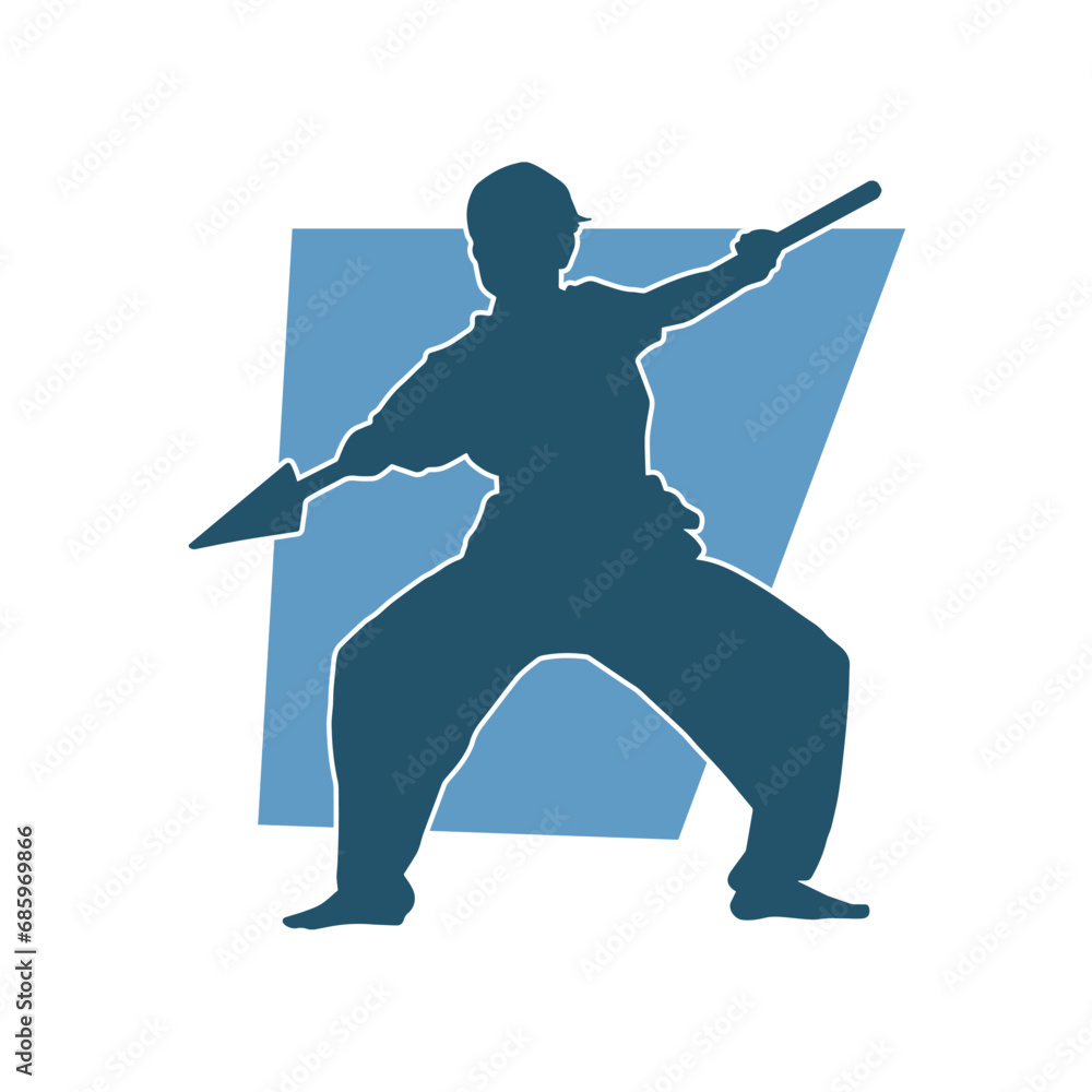 Silhouette of a slim female fighter in standing pose with her staff ...