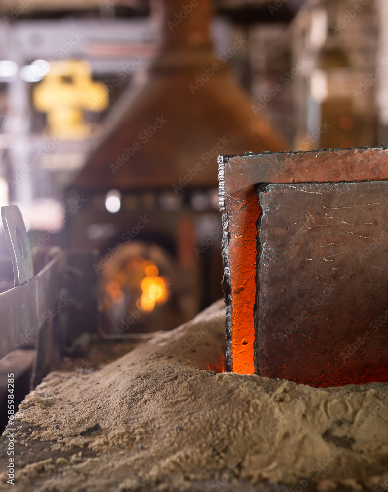 Foundry ferrous metal is melted in an induction furnace of ...