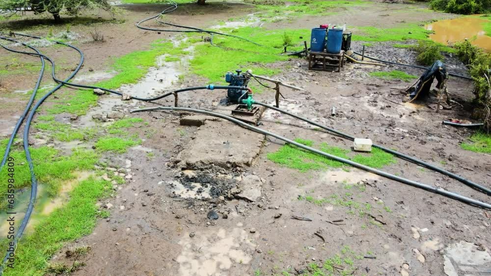 Irrigation water pumps abstructing water from the flooded river. Floods ...