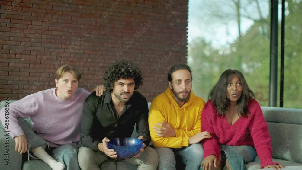 multicultural friends in exuberant celebration rejoicing and cheering ...