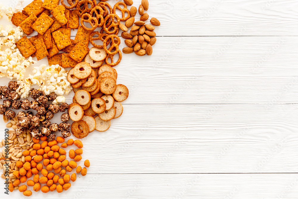 Mix of snacks - pretzels nuts chips top view. Fast food background ...