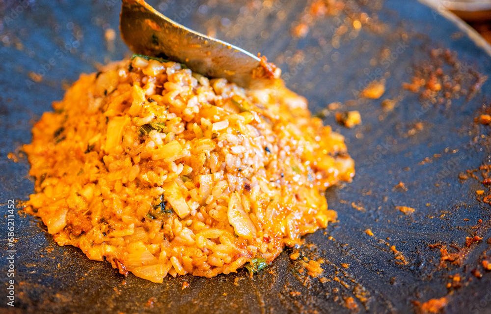 Delicious volcanic shaped fried rice with egg and spicy sauce, pork and ...