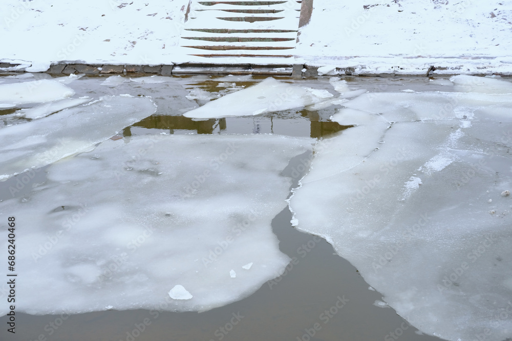 ice in river, lake, city reservoir, ice floes in dark water, ice blocks ...
