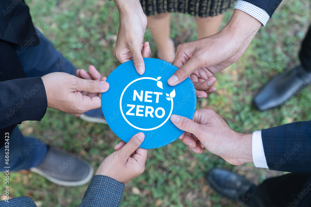 Business people holding ECO friendly idea symbol together as group of ...