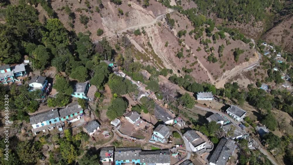 Bird-eye view of terraced houses and terrace farming in a remote hilly ...