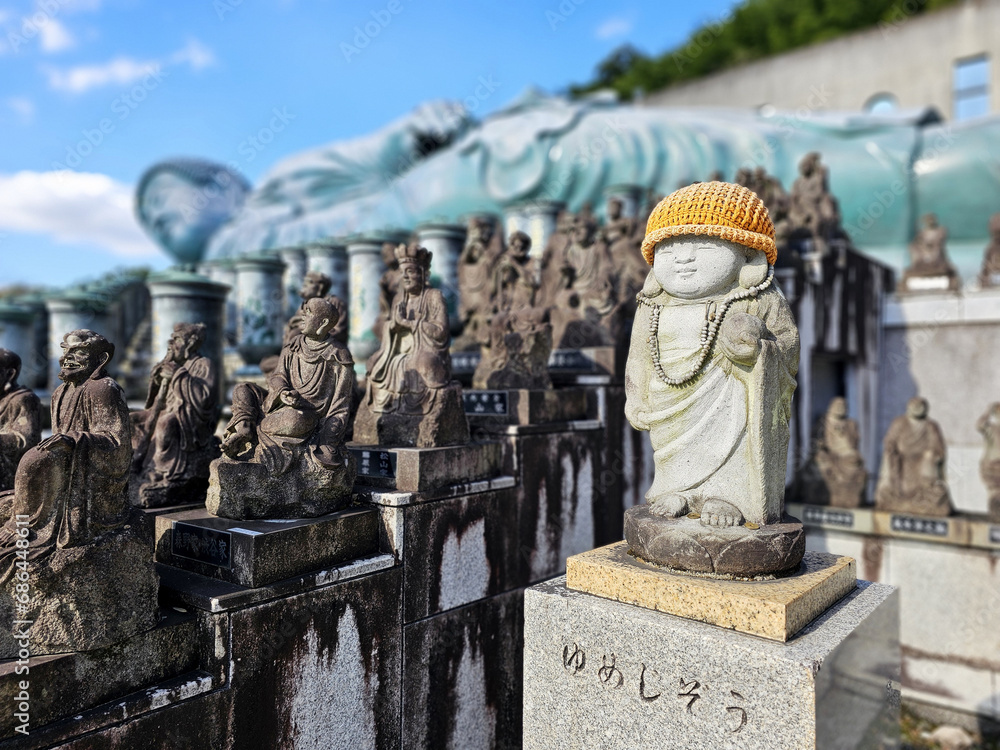 FUKUOKA, JAPAN - NOVEMBER 14, 2023: Close up cute stone monk statue at ...