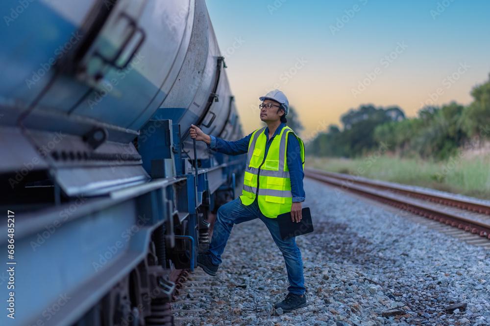 Engineer under inspection and checking construction process railway ...