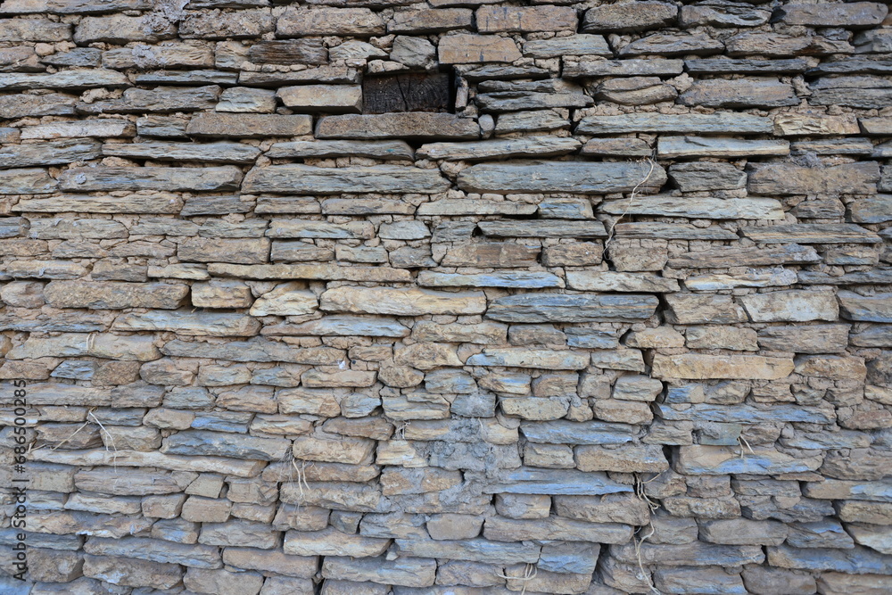 house of traditional rock wall in a Gurung village in Ghandruk town ...
