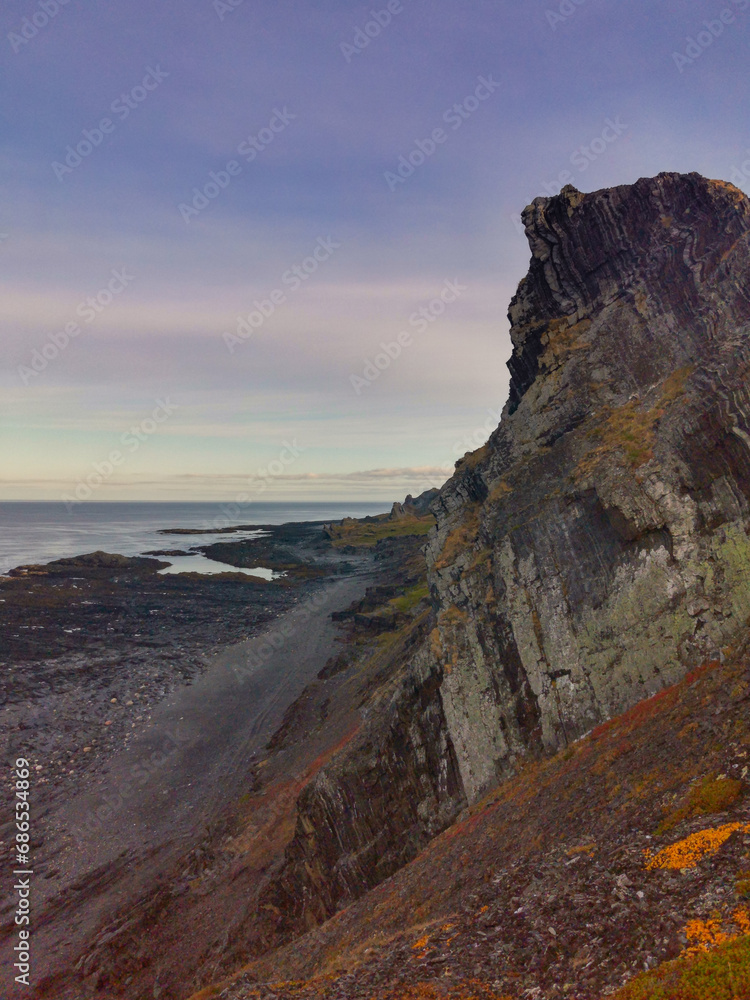 The rocky coast of the Barents Sea. Beautiful view of the rocks and the ...