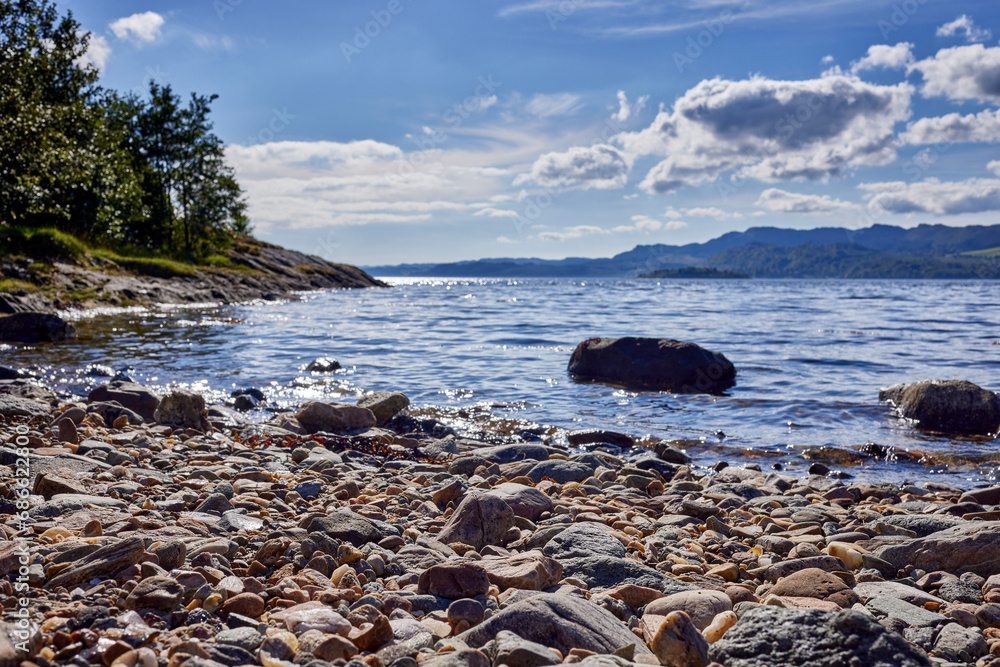 Late September afternoon, a close up view of the rock strewn beach ...
