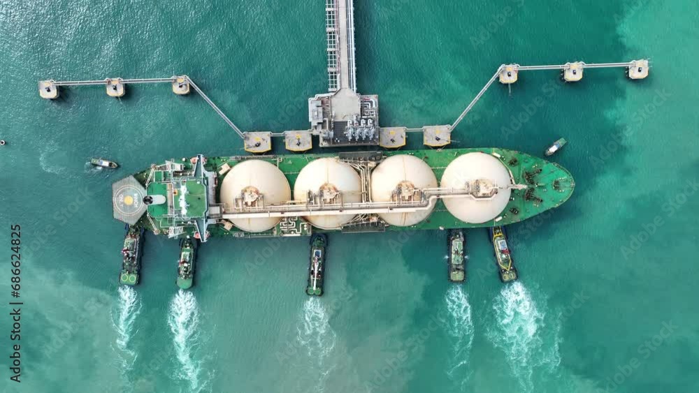 LNG (Liquified Natural Gas) tanker anchored in Gas terminal gas tanks ...