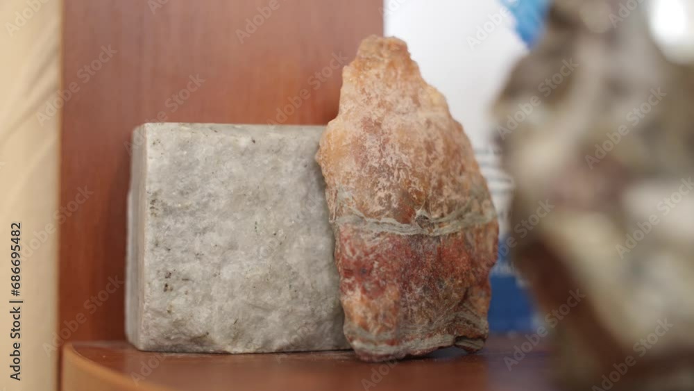 Stones on a shelf with a porous structure. Hobby collecting various ...