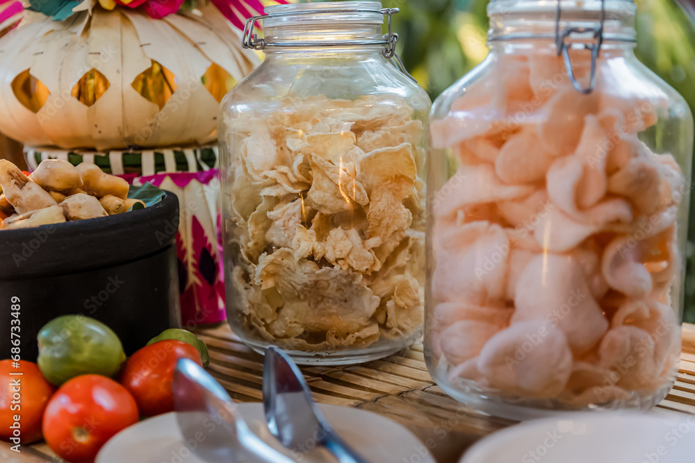 Crispy chips made of starch, flour and shrimp in jars during catering ...