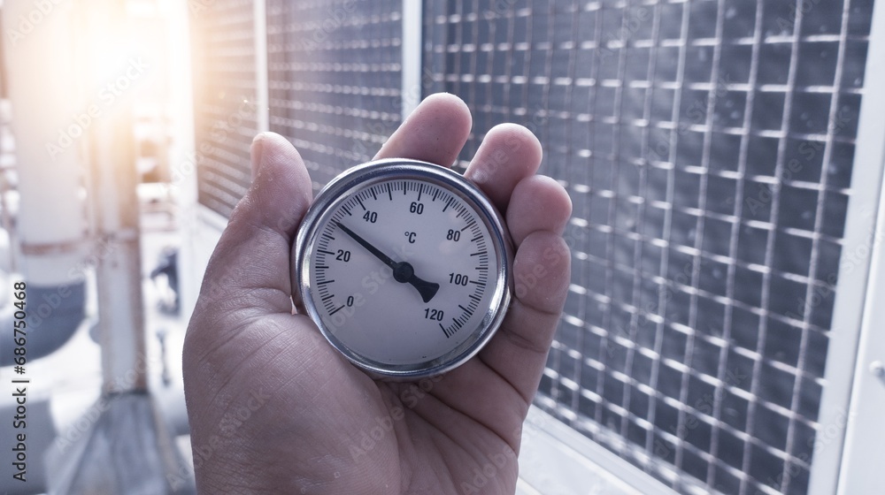 Measure the temperature of Condenser Chiller unit area using an analog ...