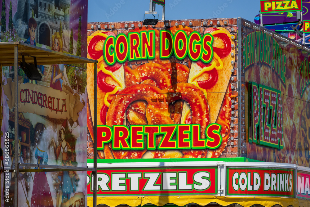 Colorful signs for corn dogs, pretzels, cold drinks, and New York Style ...