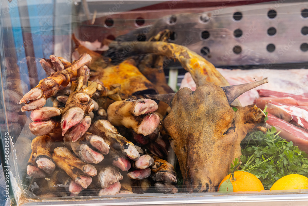Goat feet and head at a butcher shopt in a market at the Houmt Souk ...