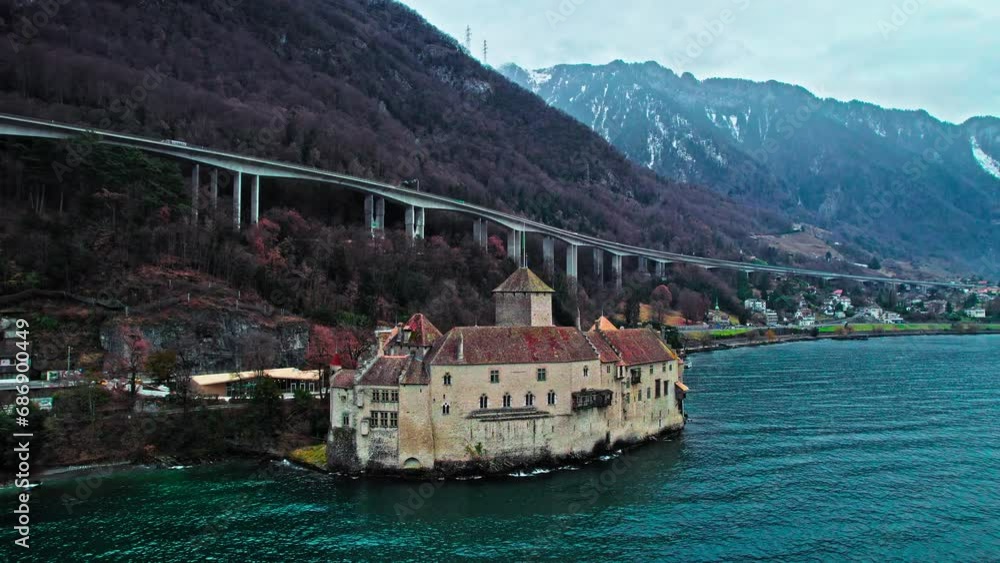 Close-up aerial view of Lakeside Chillon Castle with red rooftop in ...