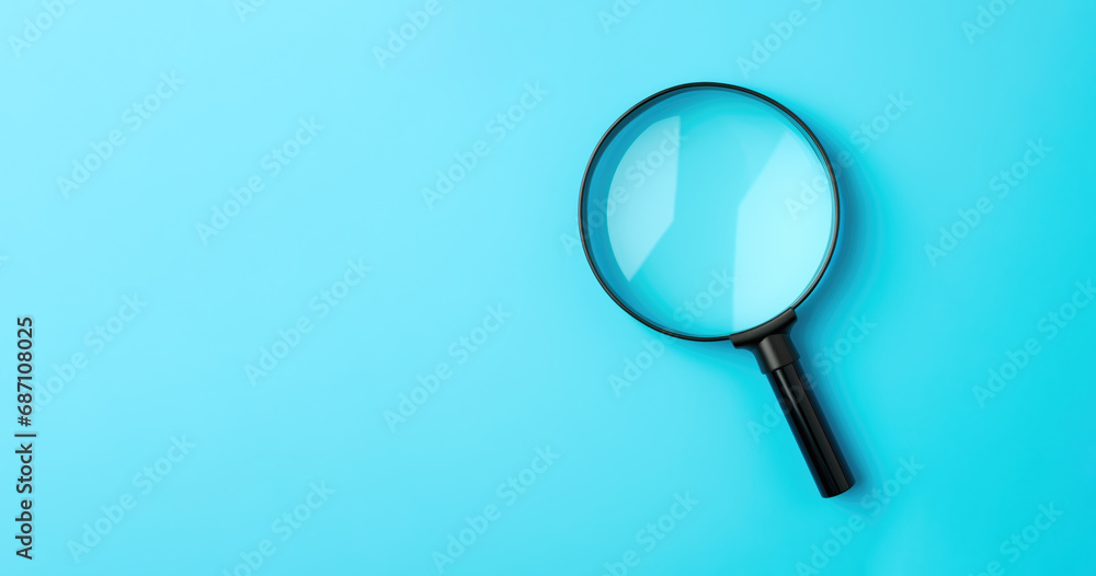 Magnifier on a light blue color background with copy space. Magnifying ...