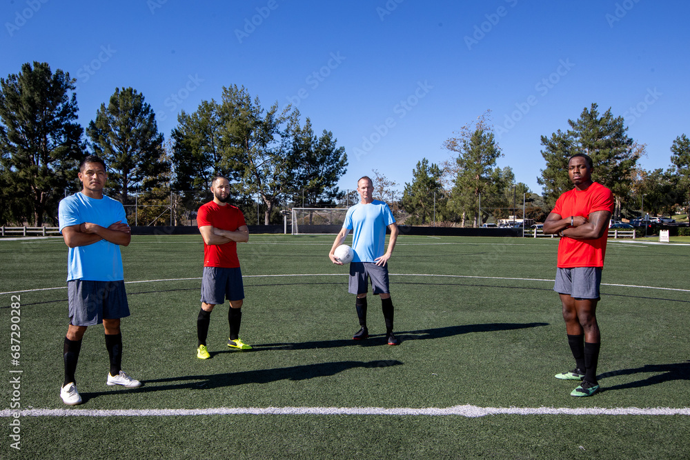 Soccer players work together as a team playing the game together. The ...